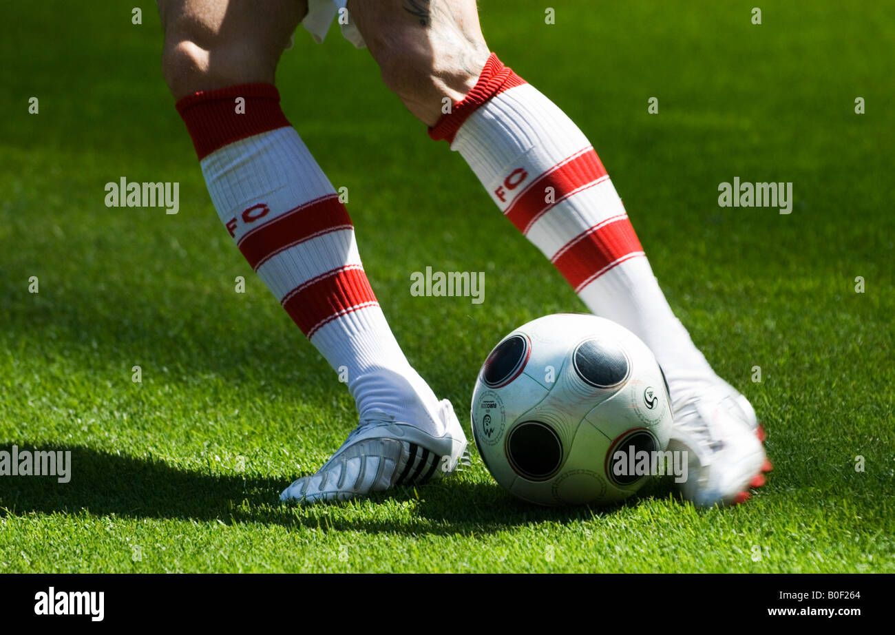 Football at feet hi-res stock photography and images - Alamy