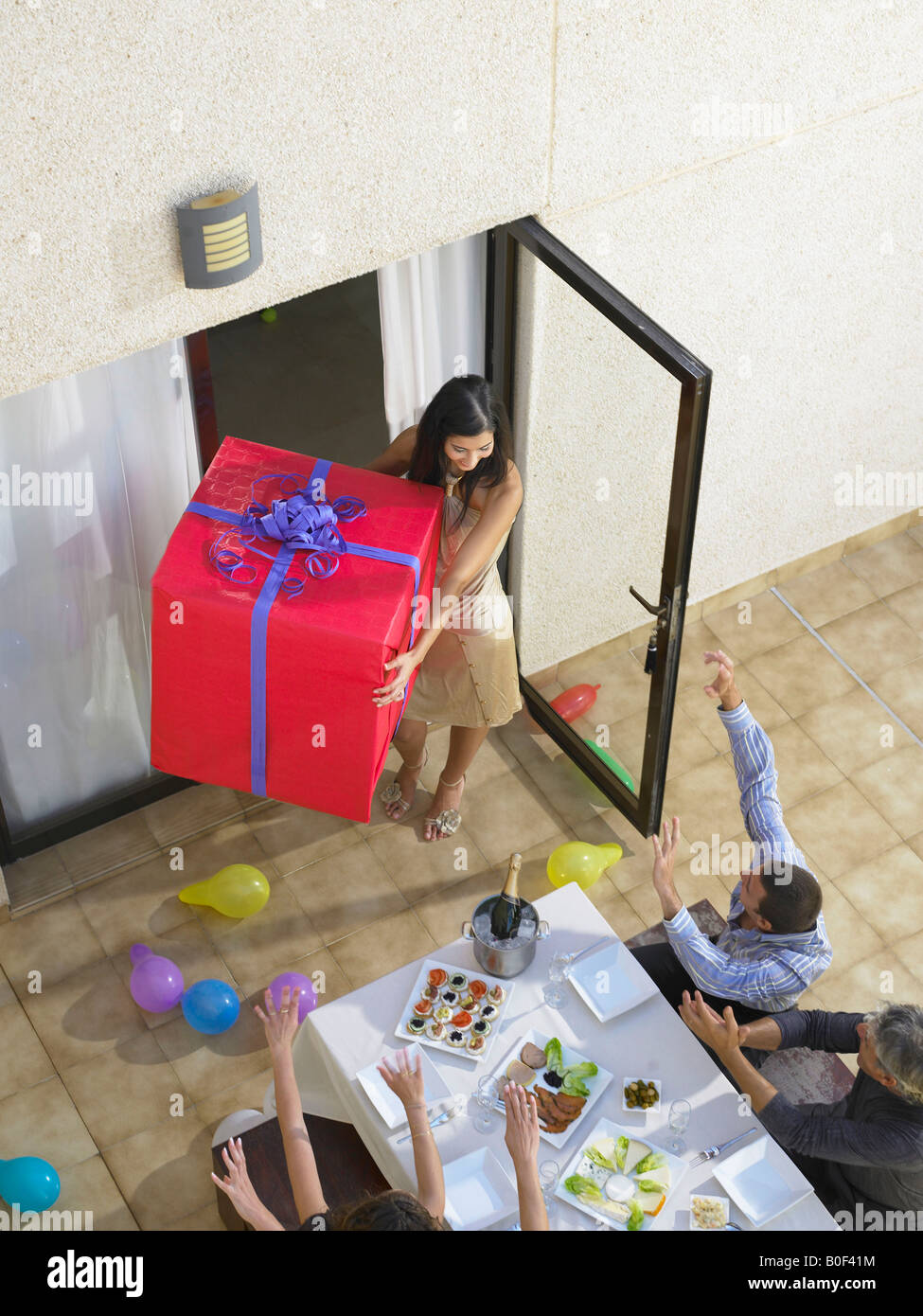 Arriving with gifts to the party Stock Photo - Alamy