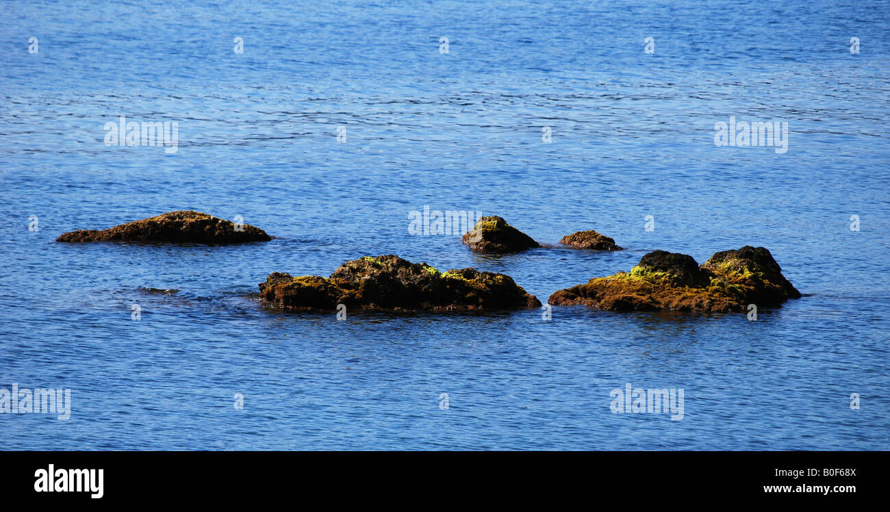 A formation of small rocks near the seahore Stock Photo - Alamy