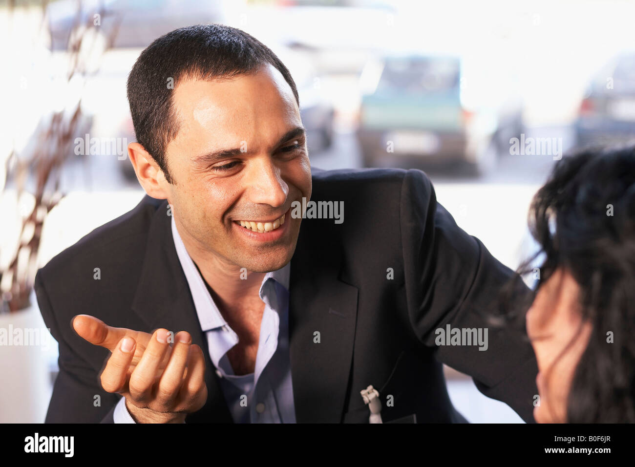 Man in conversation with woman Stock Photo - Alamy