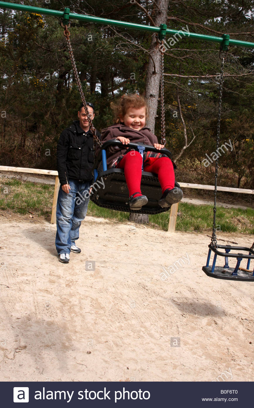 Pushed Child On Swing Stock Photos & Pushed Child On Swing Stock Images ...