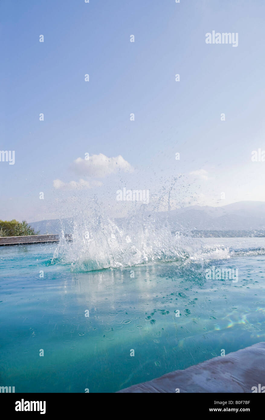Splash in a pool Stock Photo - Alamy