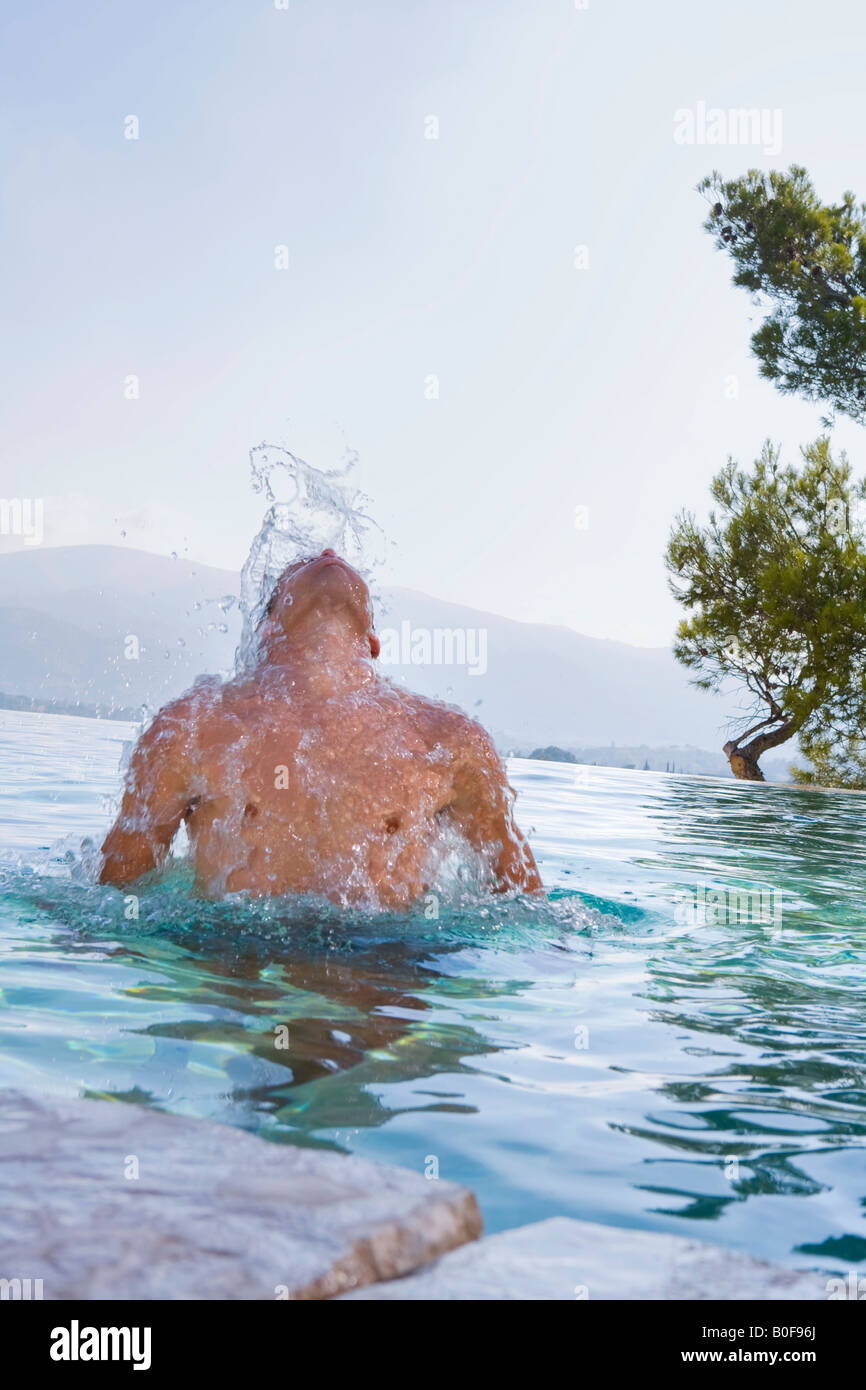 Male swimmer emerging from pool hi-res stock photography and images - Alamy