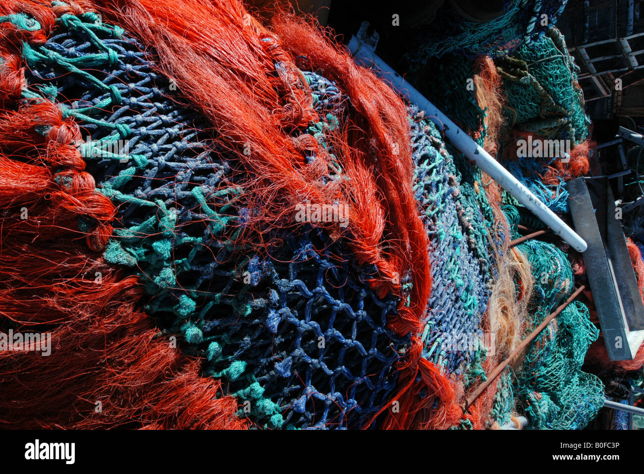 Colourful fishing nets on fishing boat in Weymouth Harbour UK. Nets ...