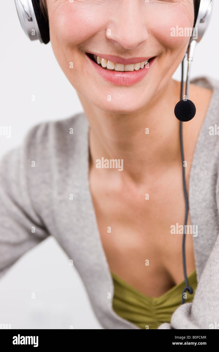 Close up woman with headset smiling Stock Photo - Alamy