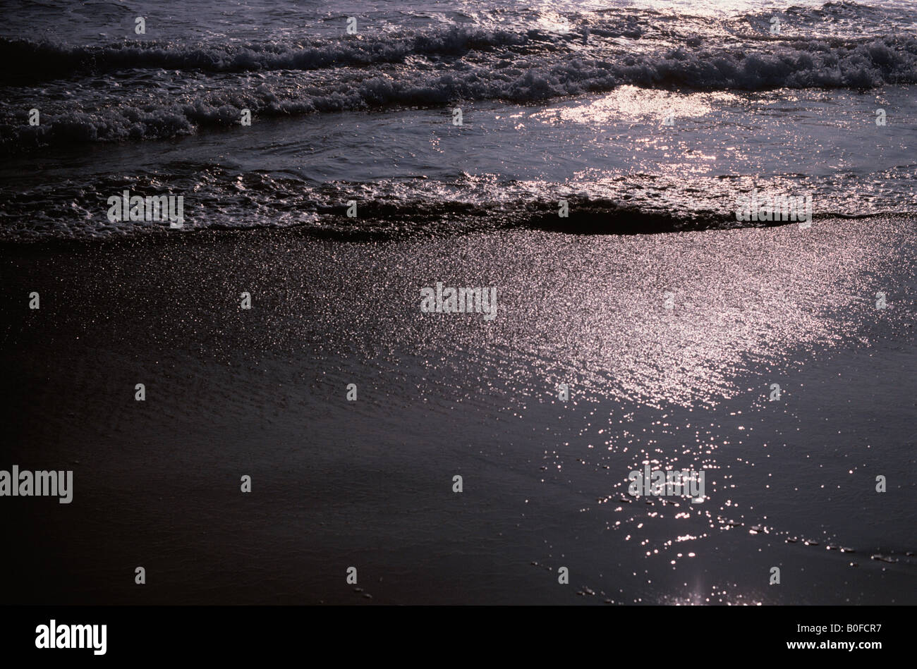Breakers Against Sand Stock Photo - Alamy