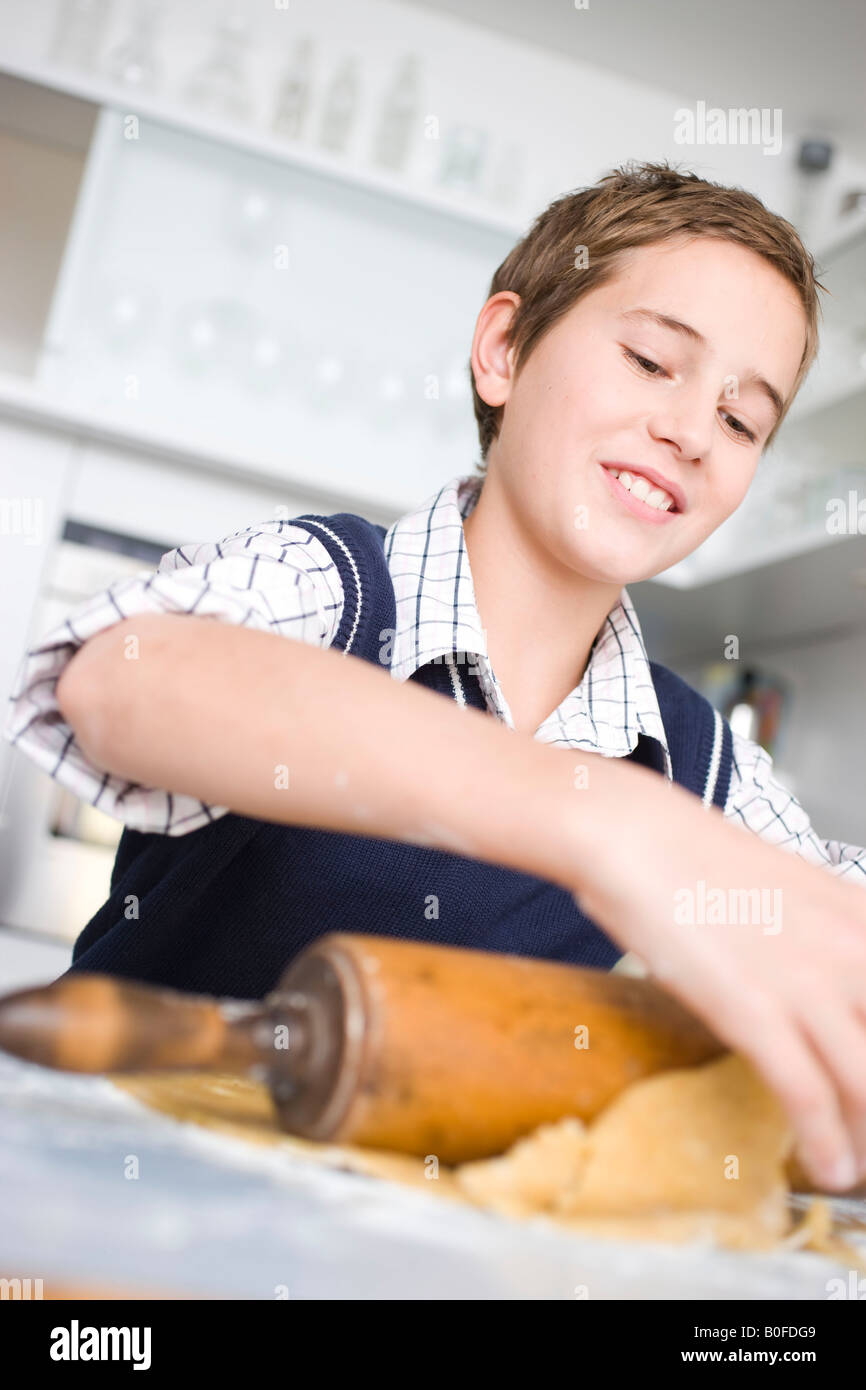 Boy preparing dough Stock Photo - Alamy