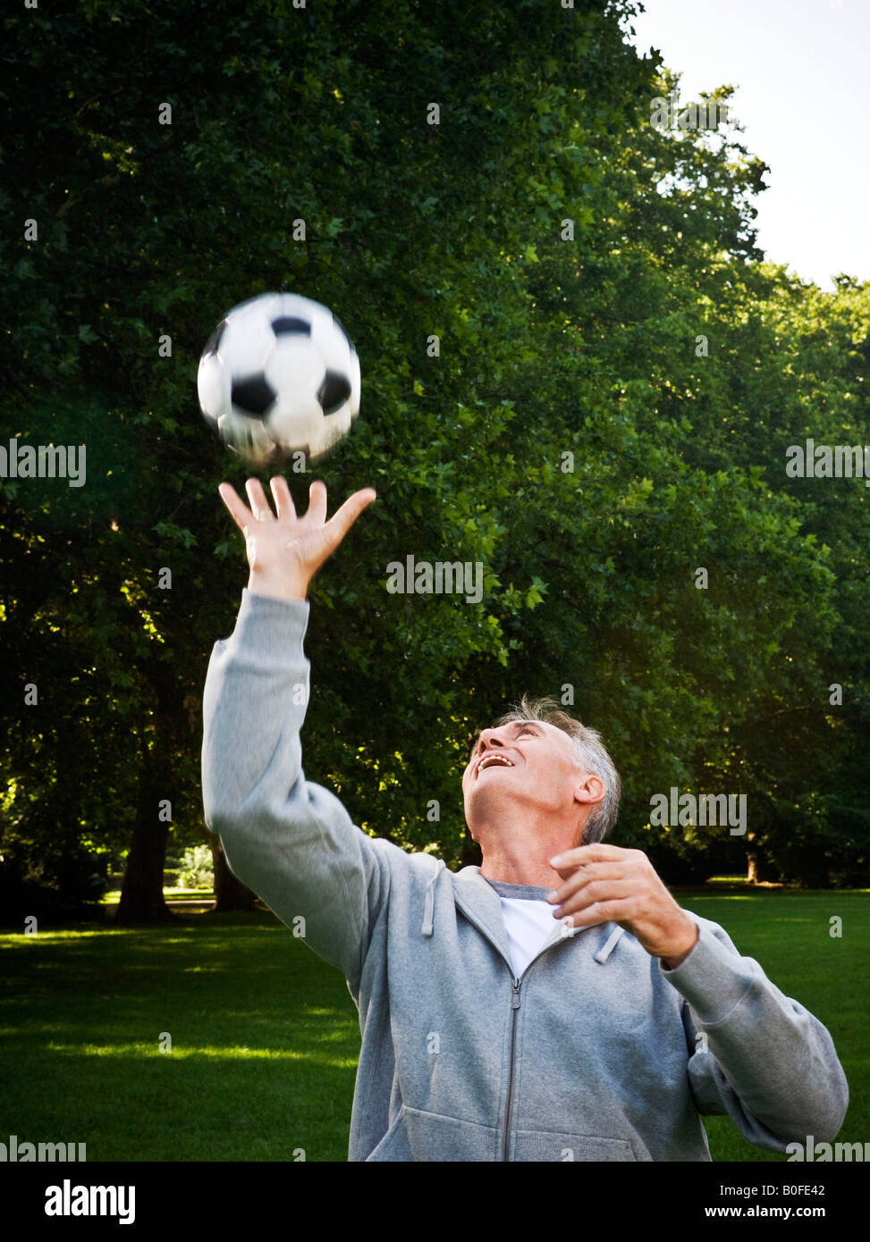 Man catching ball Stock Photo - Alamy