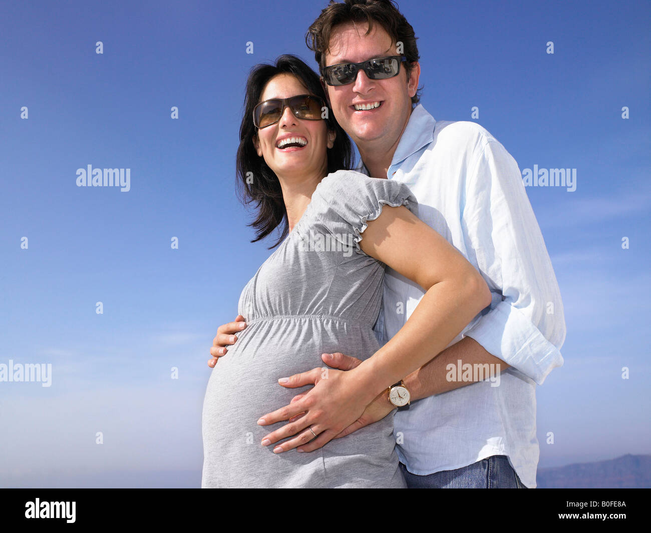 Pregnant woman hugging partner hi-res stock photography and images - Alamy