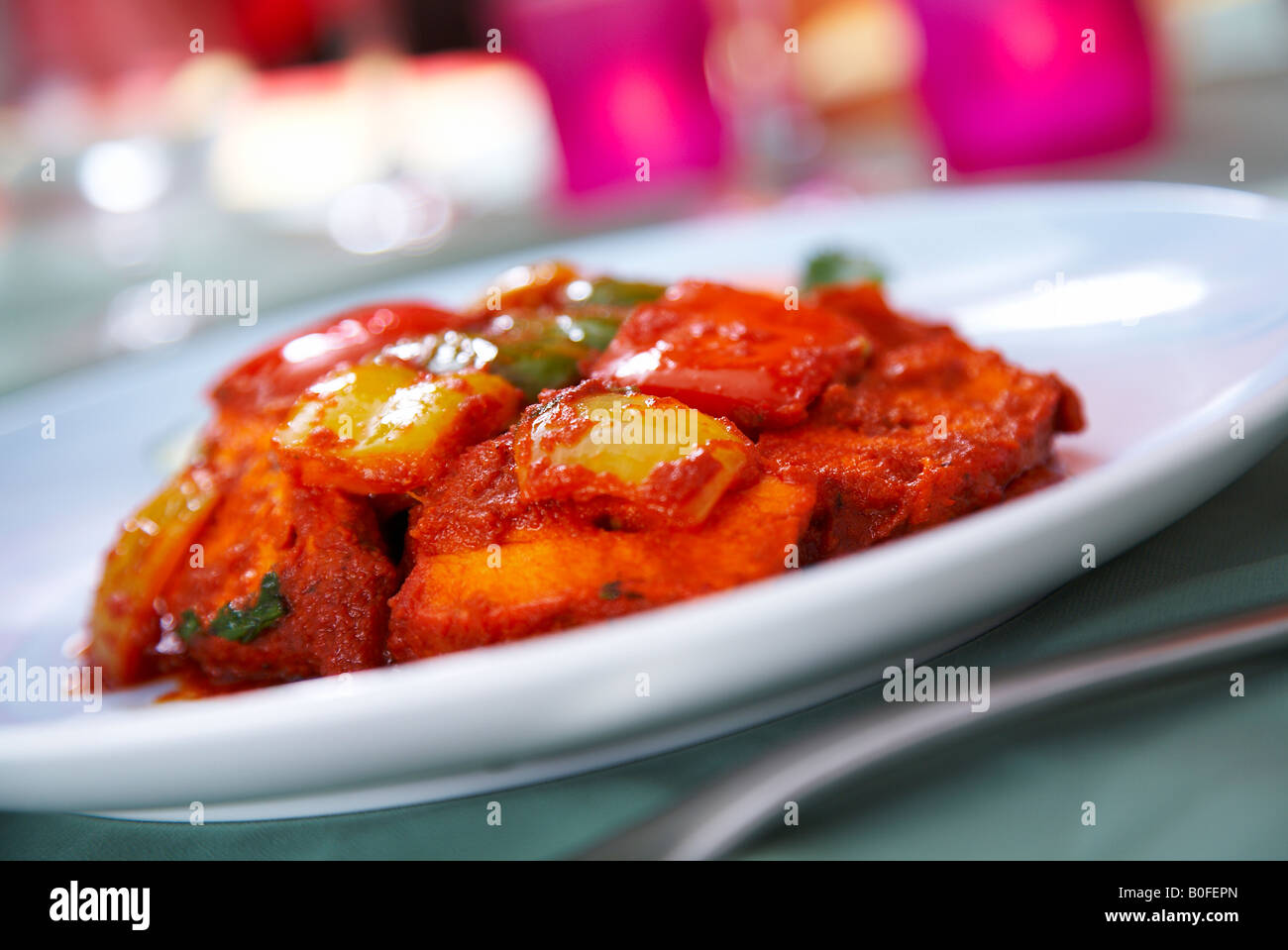 Chicken rogan josh on a plate Stock Photo - Alamy