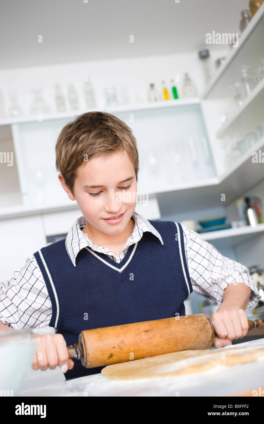 Boy preparing dough Stock Photo - Alamy