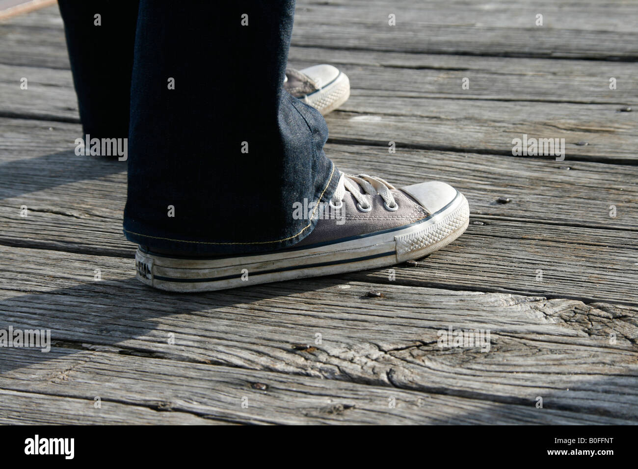 one person walking in street in city town Stock Photo - Alamy