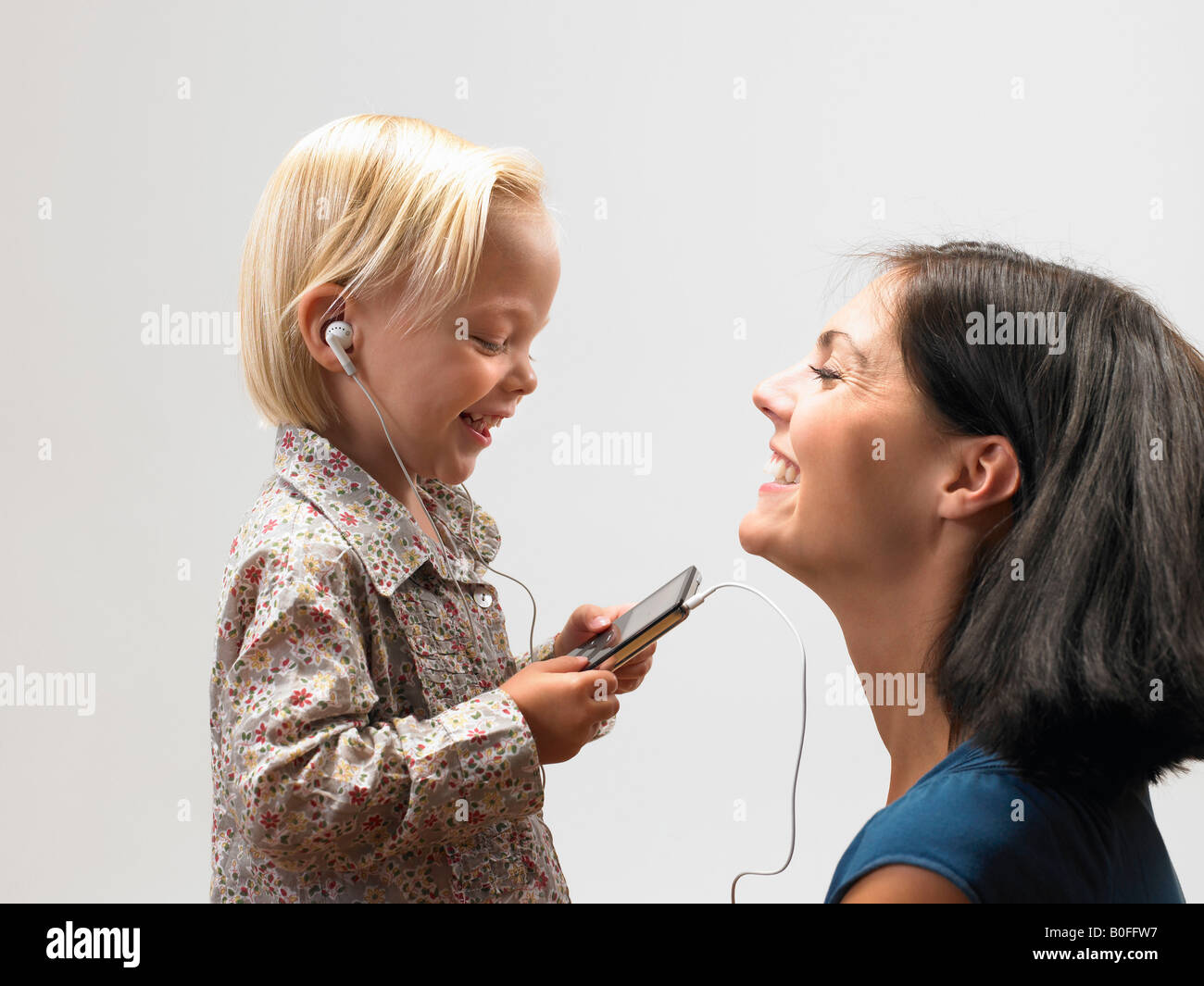 Daughter standing listening mother two hi-res stock photography and ...