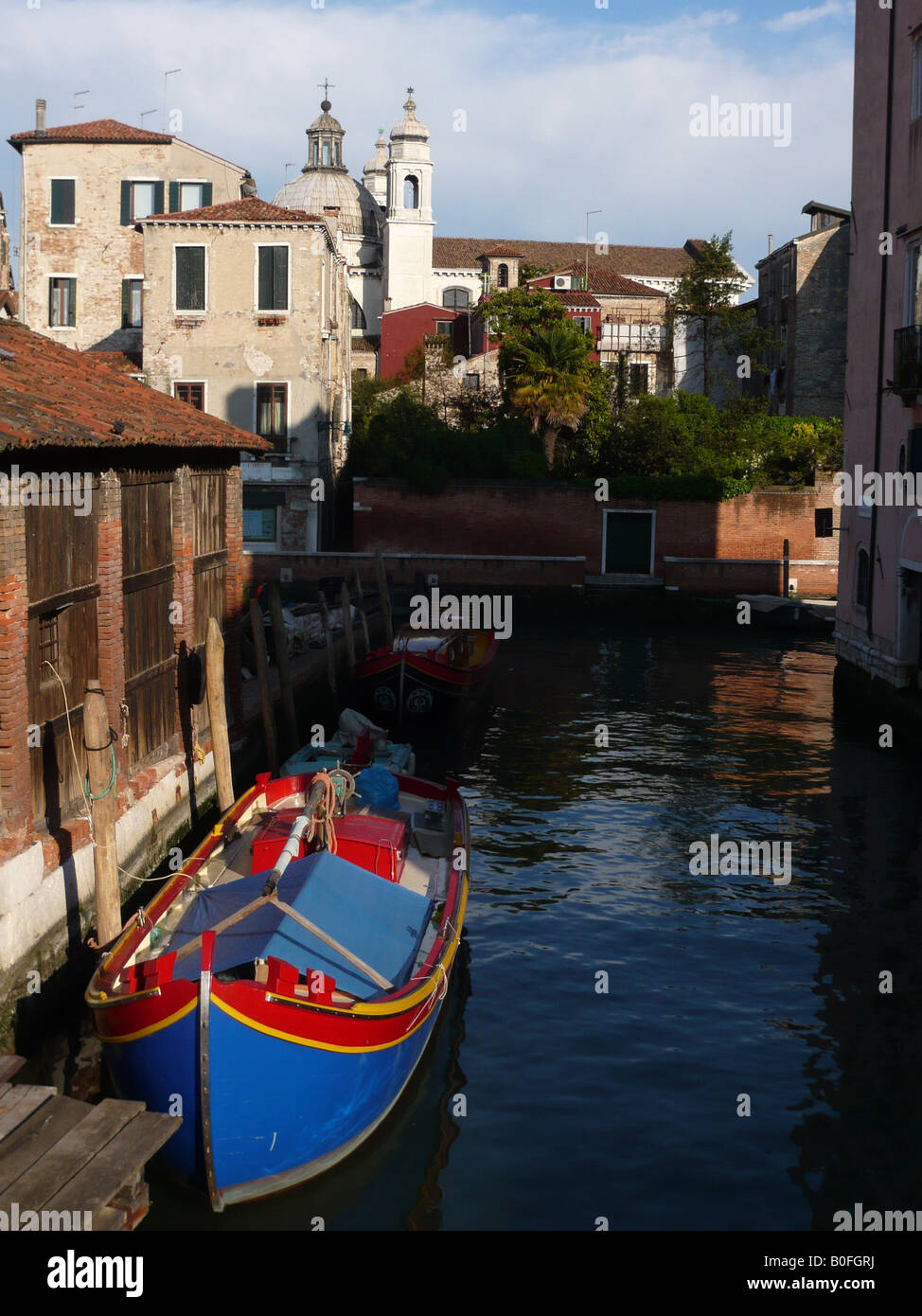 Colorful barge in a quiet canal in Venice, Italy Stock Photo - Alamy