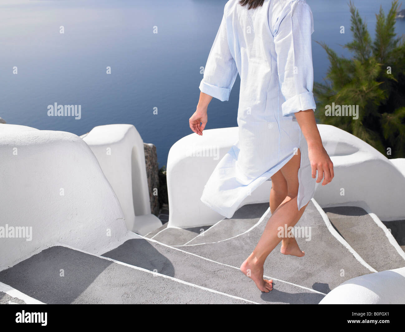 Woman climbing down the stairs Stock Photo - Alamy