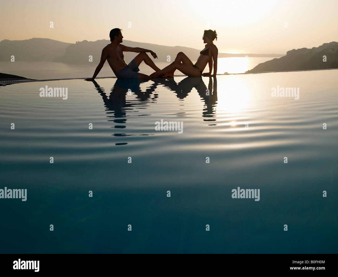 Woman lounging poolside hi-res stock photography and images - Alamy