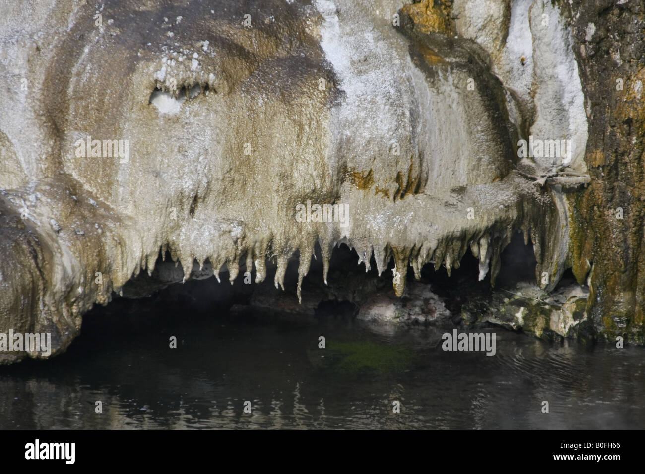 Close-up on the multicolored silica and sulfuric rock and pool by ...