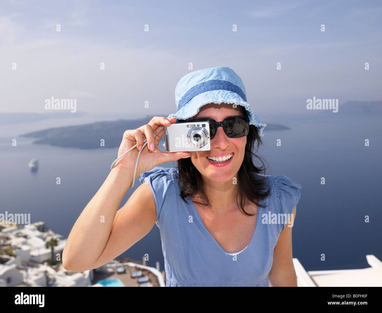 Woman taking a picture Stock Photo - Alamy