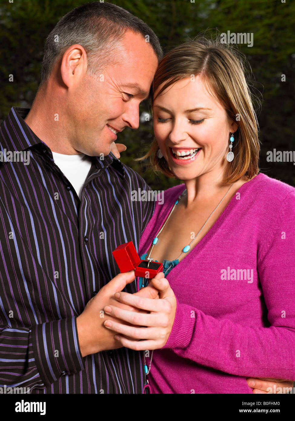 Man proposing to woman Stock Photo - Alamy