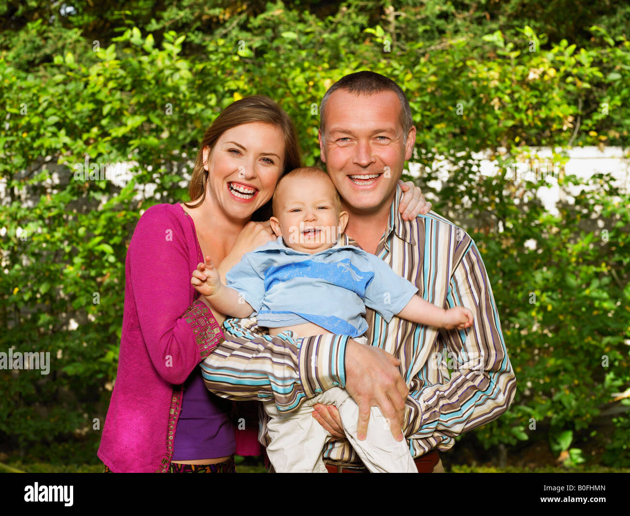 Portrait of mother, father and baby Stock Photo - Alamy