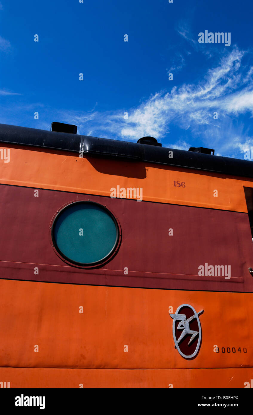 Porthole window in colorful colourful orange train locomotive under ...