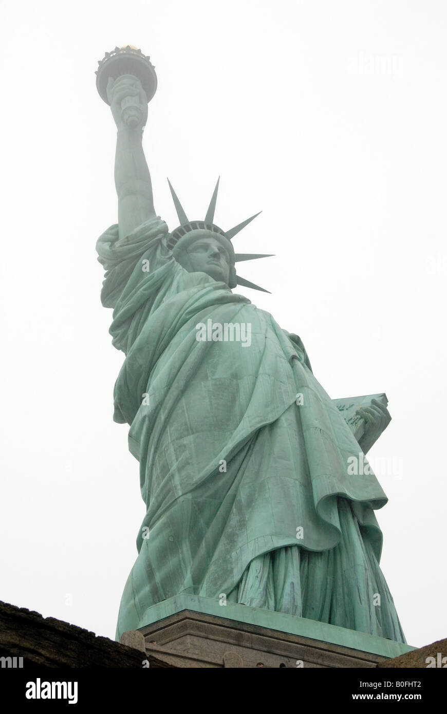 The Statue of Liberty on a cold foggy winter morning Stock Photo - Alamy