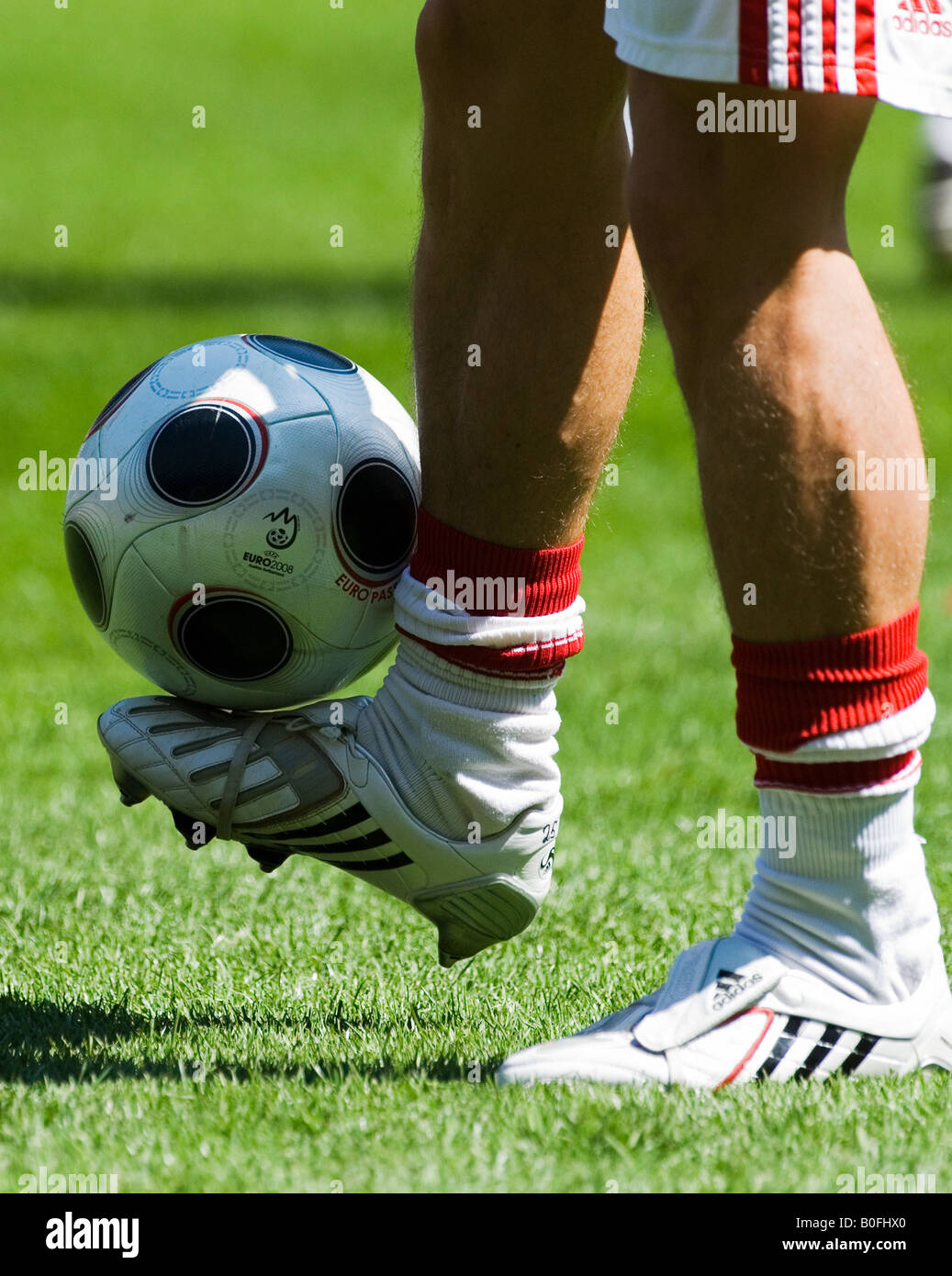 feet and boots of football player and original Europass football Stock ...