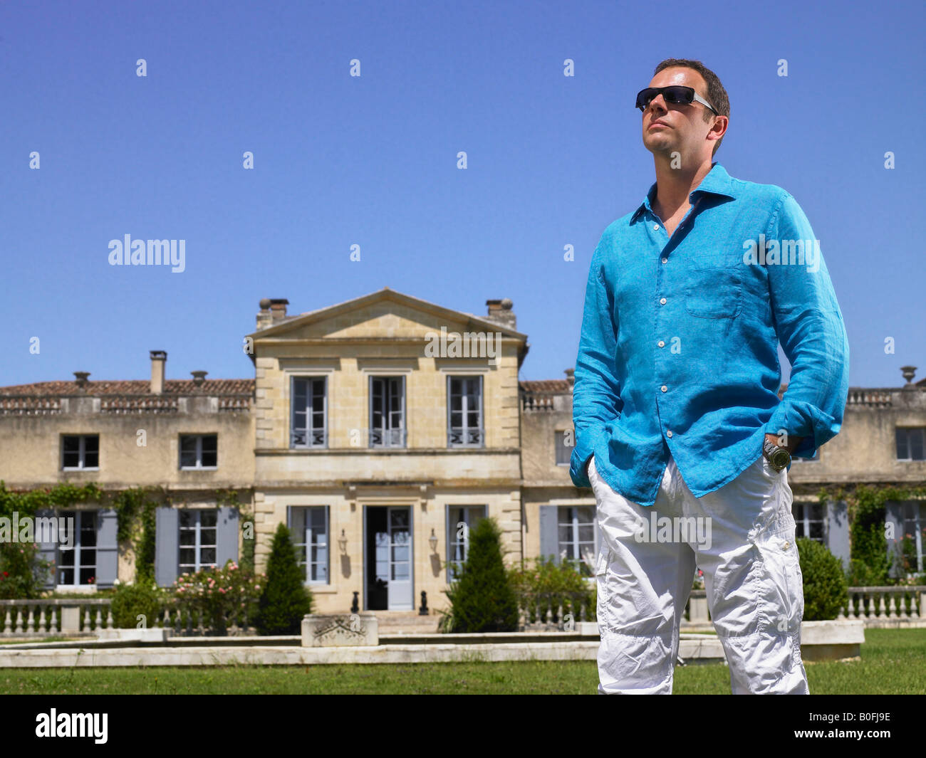 Man in front of a castle Stock Photo - Alamy