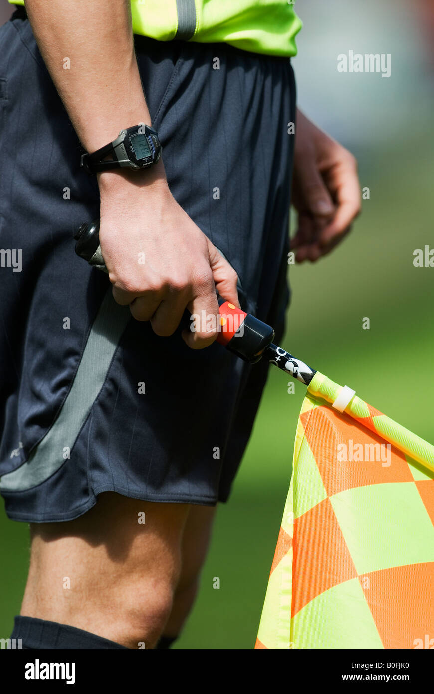 linesman holds flag Stock Photo - Alamy