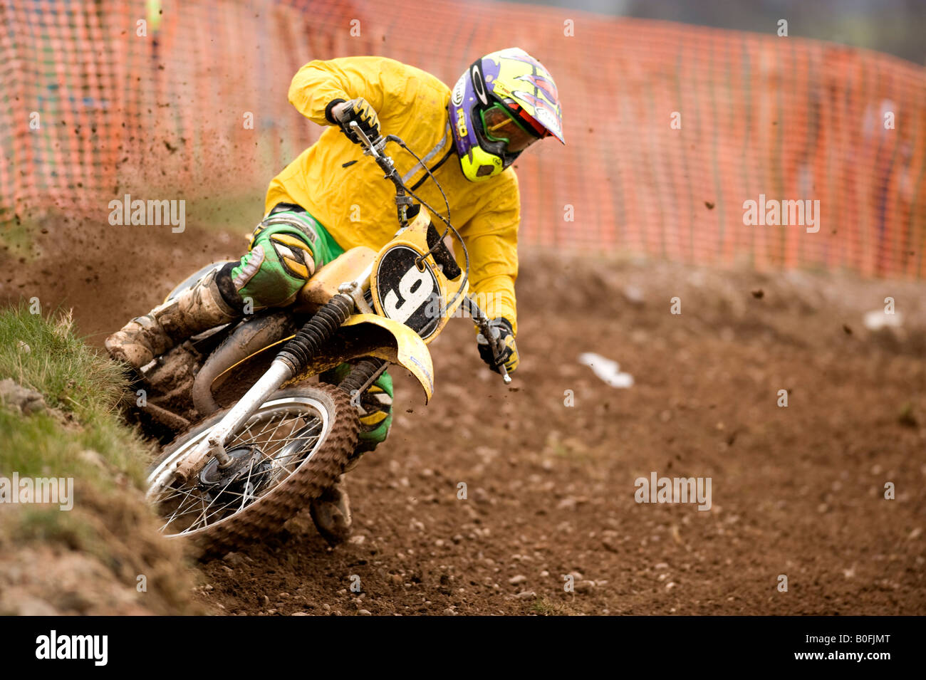 Twin shock vintage motocross rider MX Chris Walker dirt muddy with ...