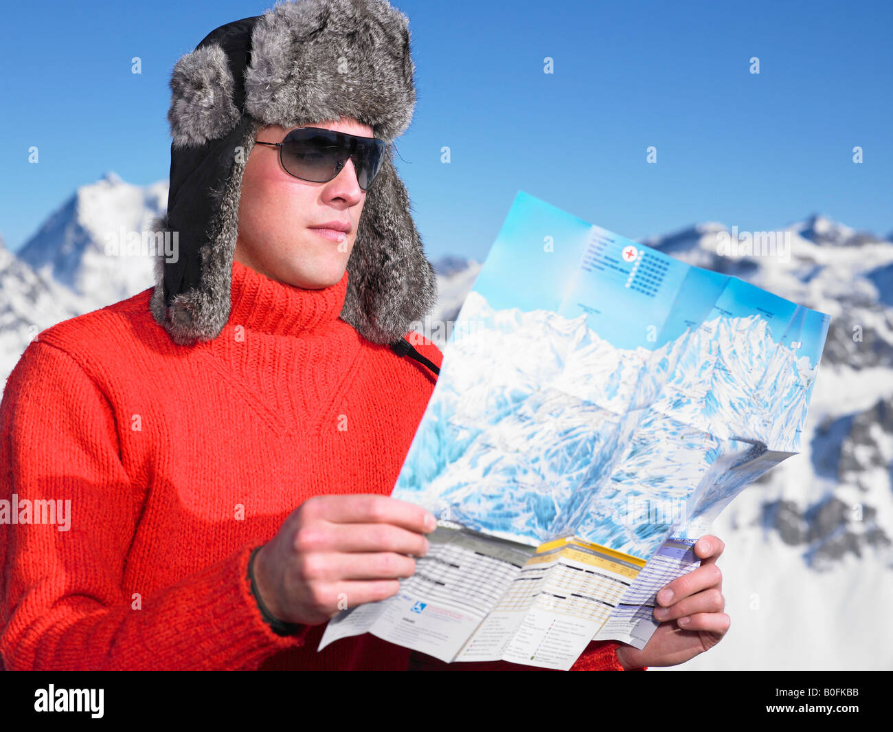 Young man looking at map Stock Photo - Alamy