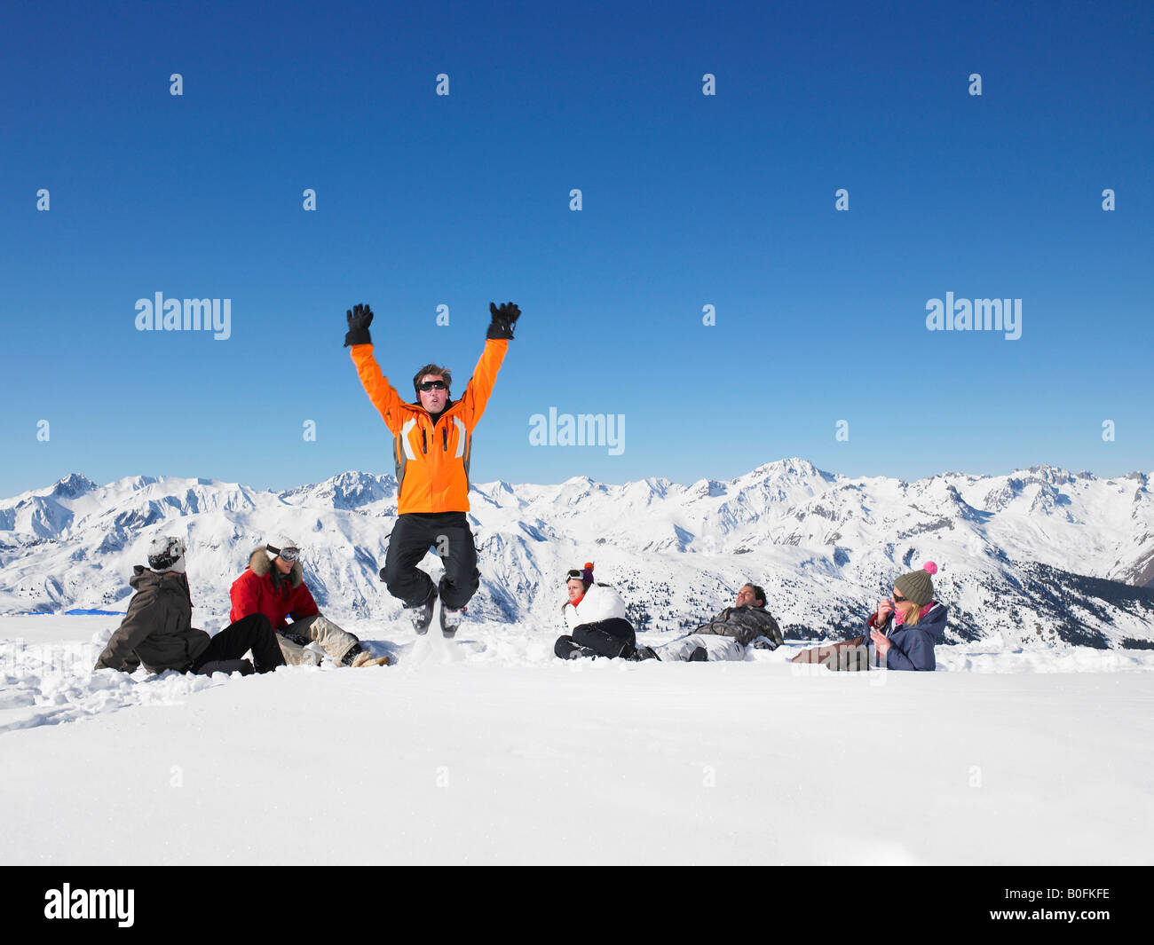 Man jumping in snow Stock Photo - Alamy