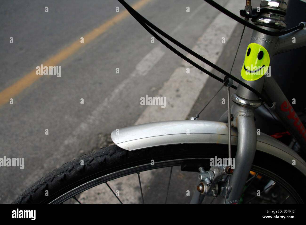 smiley face sticker on bike frame Stock Photo - Alamy