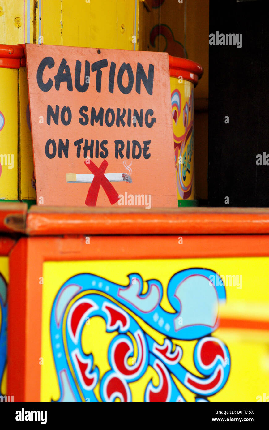 A non smoking sign at the funfair ride Stock Photo - Alamy