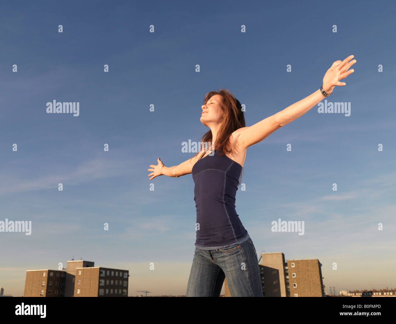 Woman standing, arms outstretched Stock Photo - Alamy