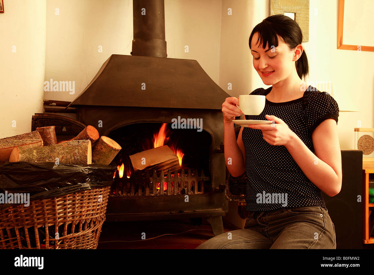 Sitting beside fire hi-res stock photography and images - Alamy