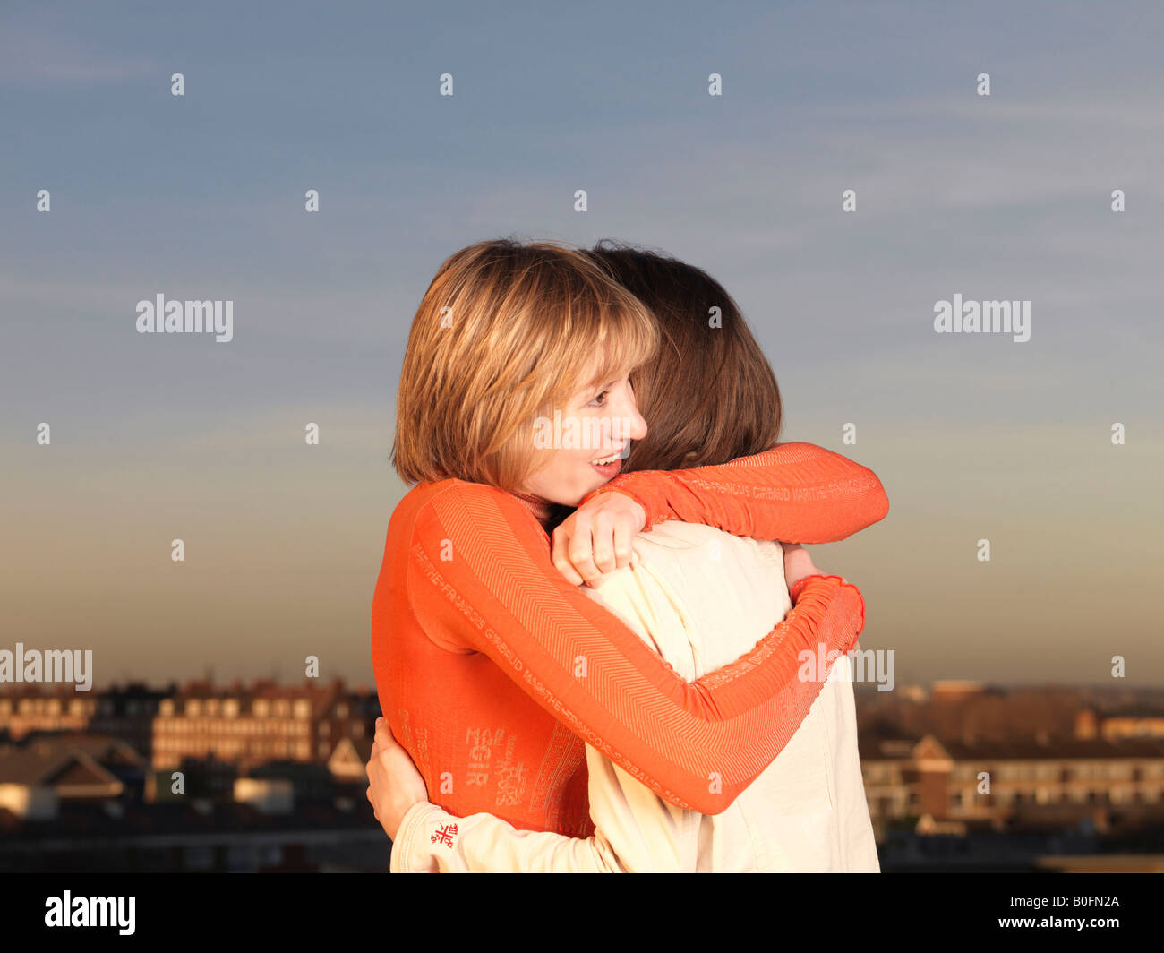 Two women hugging Stock Photo - Alamy