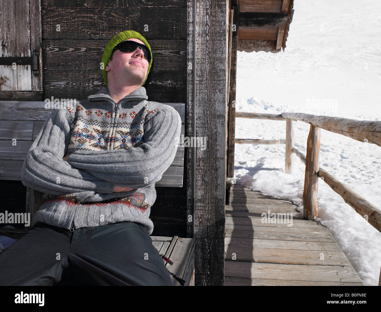 Man enjoying sun on terrace Stock Photo - Alamy