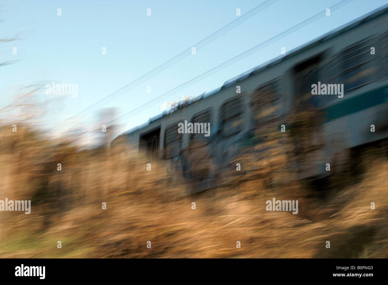 view of fast train in countryside and blue sky Stock Photo - Alamy