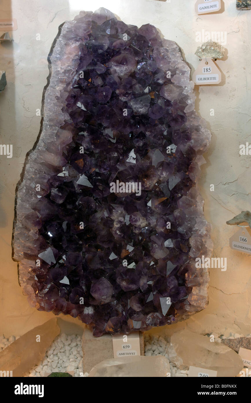 Purple Amerthyst non precious gemstone on display Stock Photo - Alamy