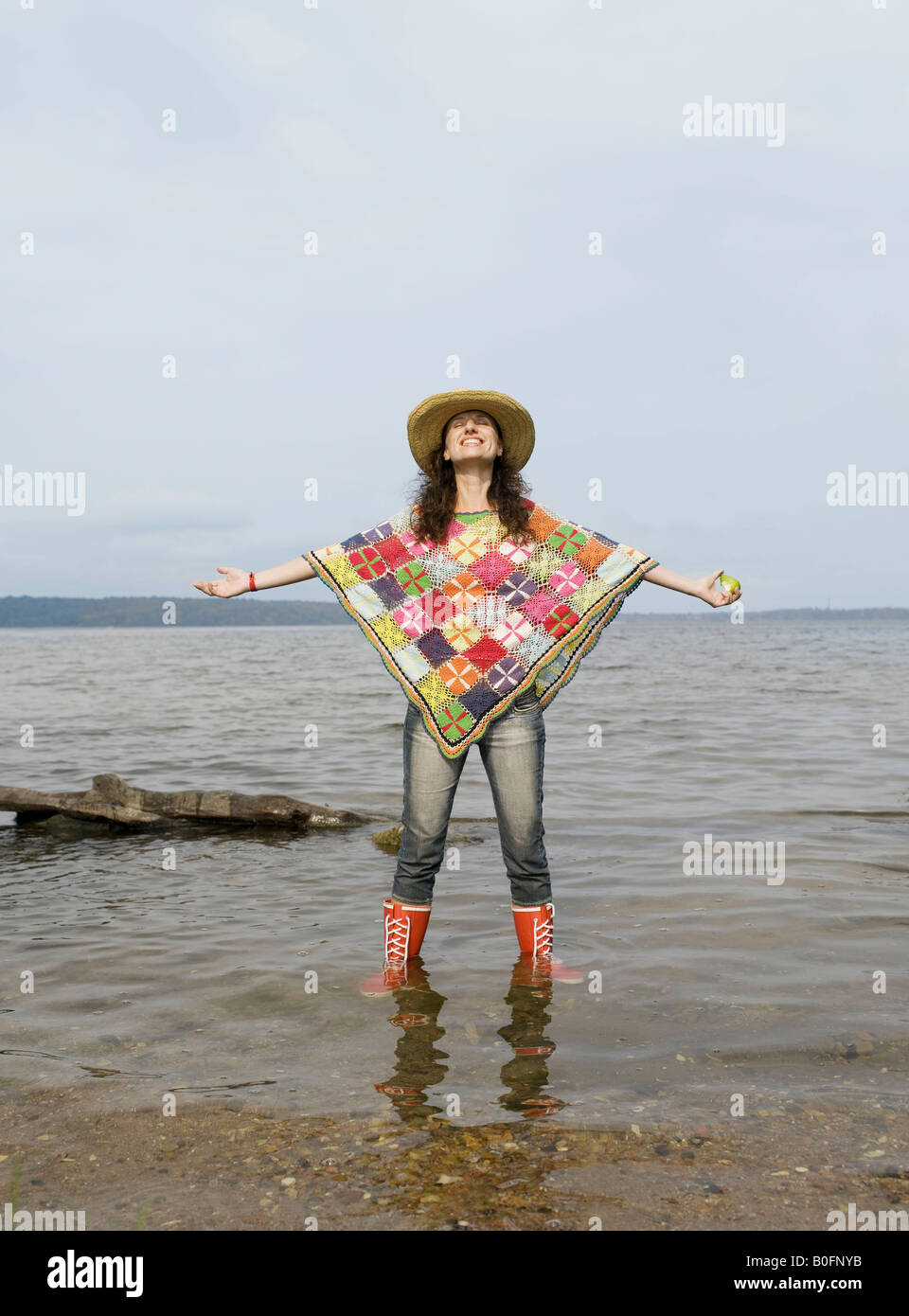 Woman standing in shallow water Stock Photo - Alamy