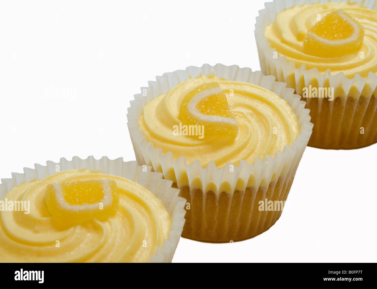Lemon buns with butter icing and sugared lemon Stock Photo - Alamy