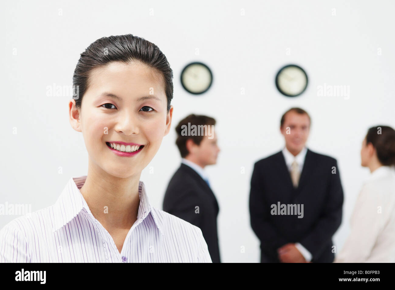 Portrait of woman, people behind Stock Photo - Alamy