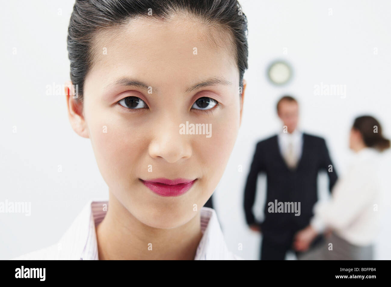 Portrait of woman, people behind Stock Photo - Alamy