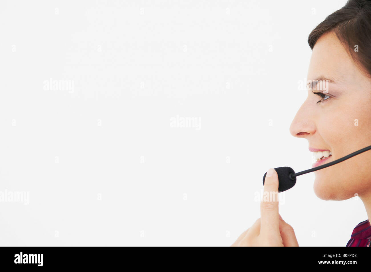 Woman in profile with headset Stock Photo - Alamy