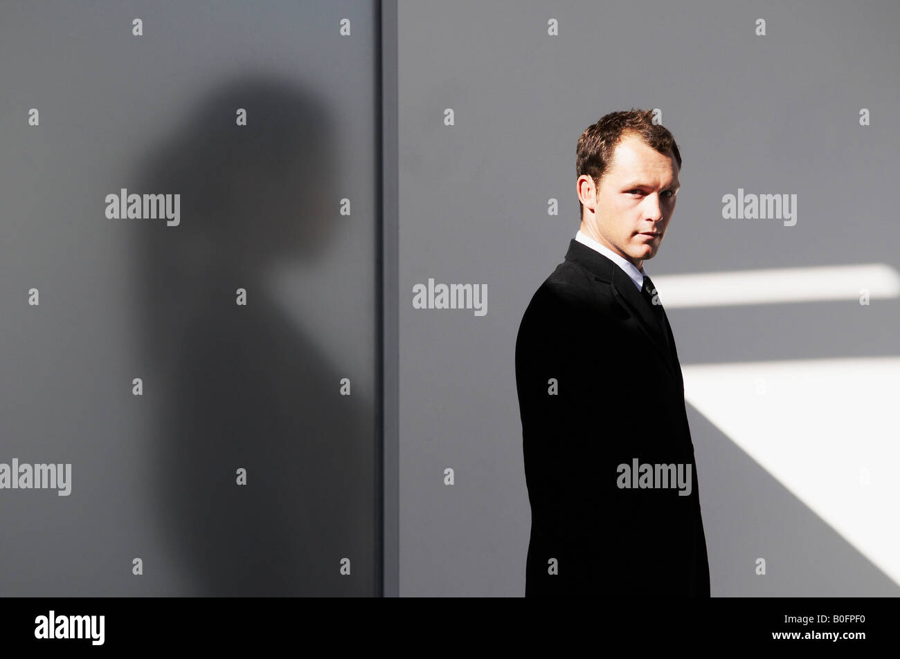 Man looking, woman behind screen Stock Photo - Alamy