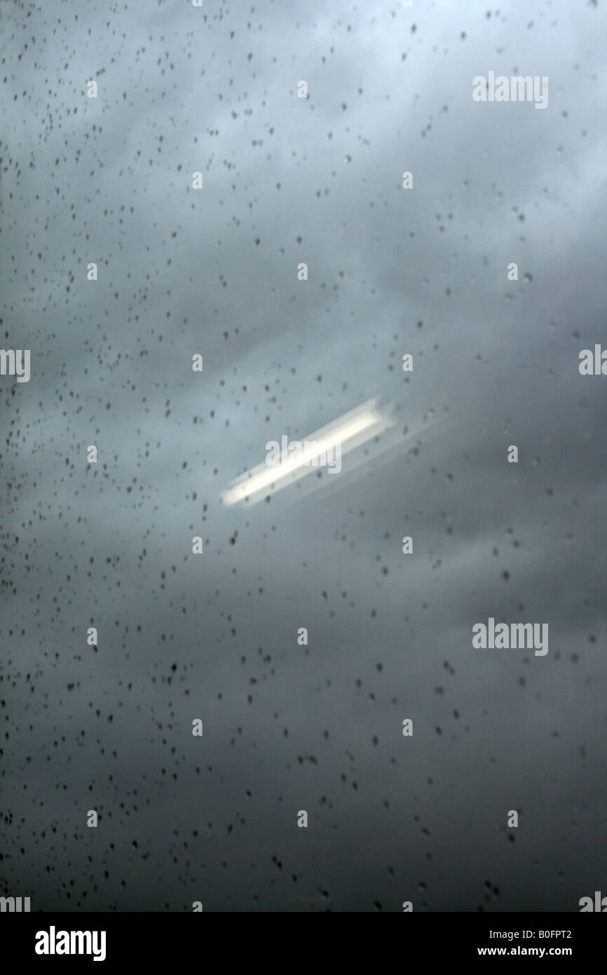 light bulb reflection on window with rain drops Stock Photo - Alamy
