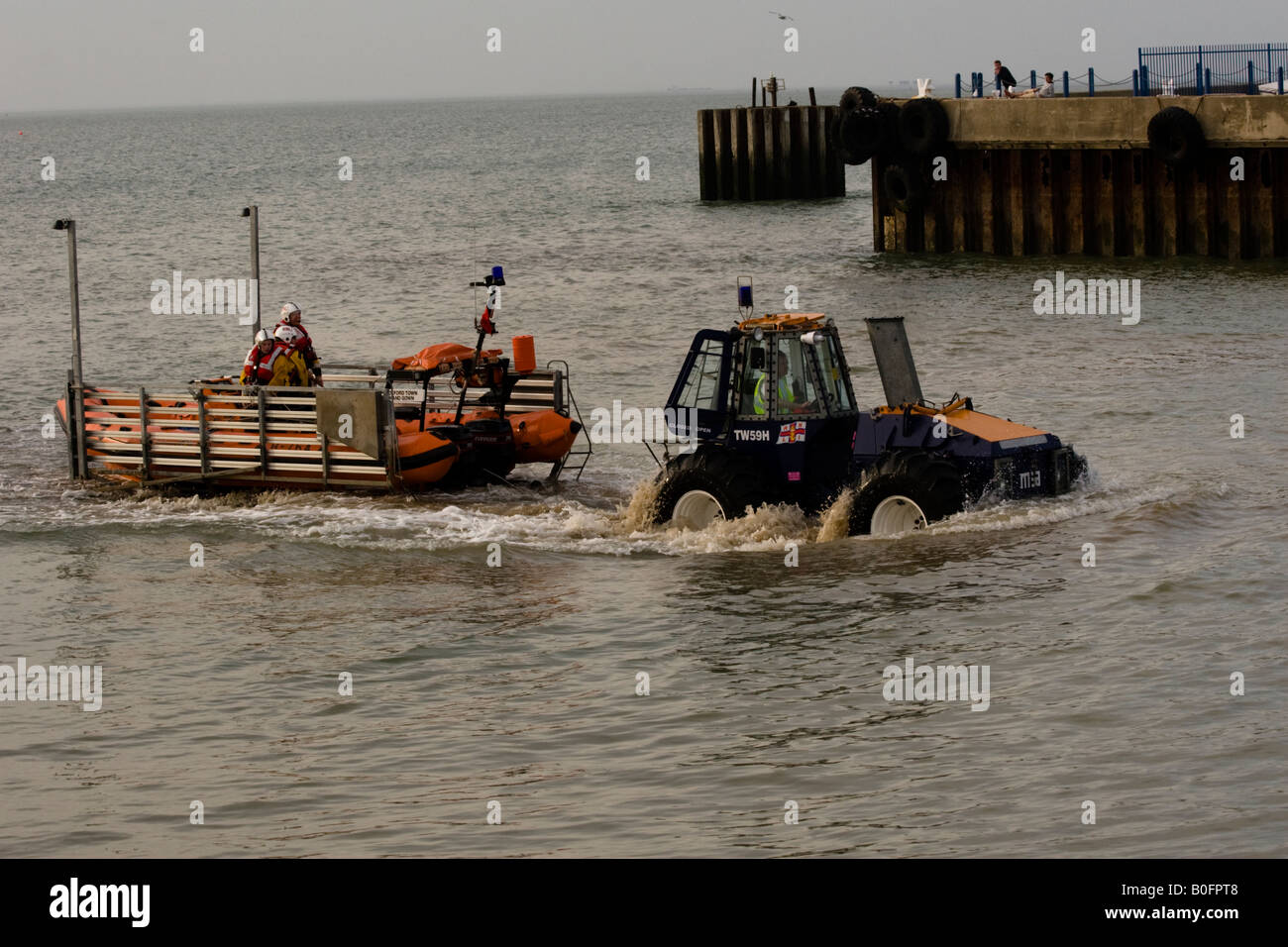 RNLI Lifeboat being towed from the water on trailer at Whitstable Kent ...