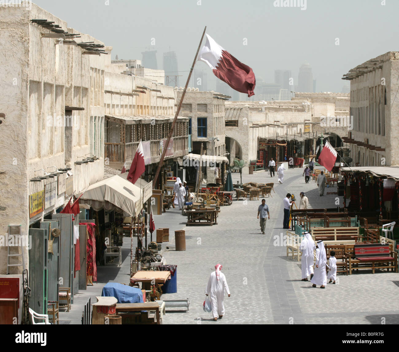 Qatari flag flapping over the Souq Waqif market in Doha, Qatar Stock ...