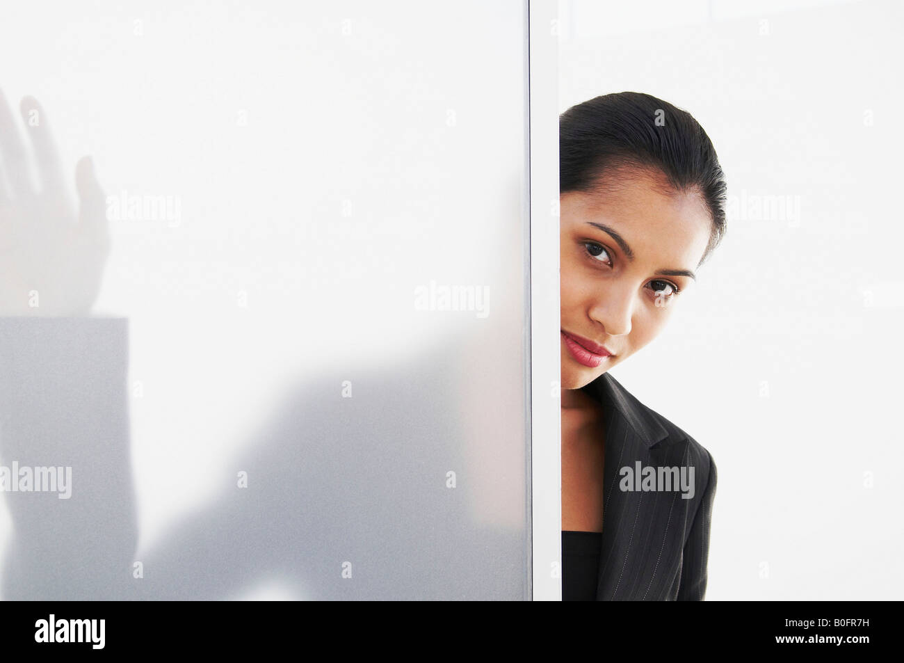 Businesswoman hand on screen to camera Stock Photo - Alamy